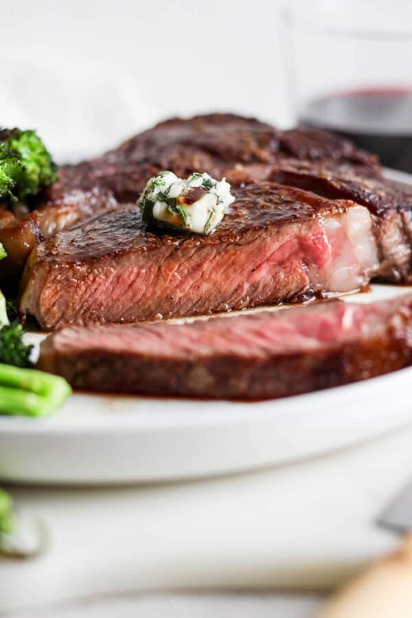 Cast Iron Ribeye Steak with Garlic Herb Butter - The Wooden Skillet